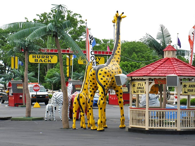 A whimsical jungle of giraffes and zebras greets visitors, proving that at Traders World, even the parking lot is an adventure.