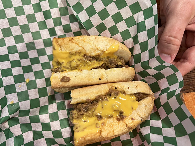 The Cheez Whiz version glistens with that signature golden glow. It's the sandwich equivalent of comfort food giving you a warm hug.