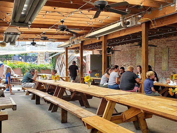 The outdoor patio, with picnic tables under string lights, captures the essence of Durham dining &ndash; casual, communal, and absolutely magical at dusk.
