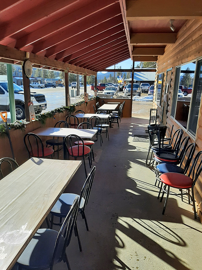 The covered porch dining area bathes in Idaho sunshine, offering mountain views with your meal&mdash;nature's version of dinner theater.