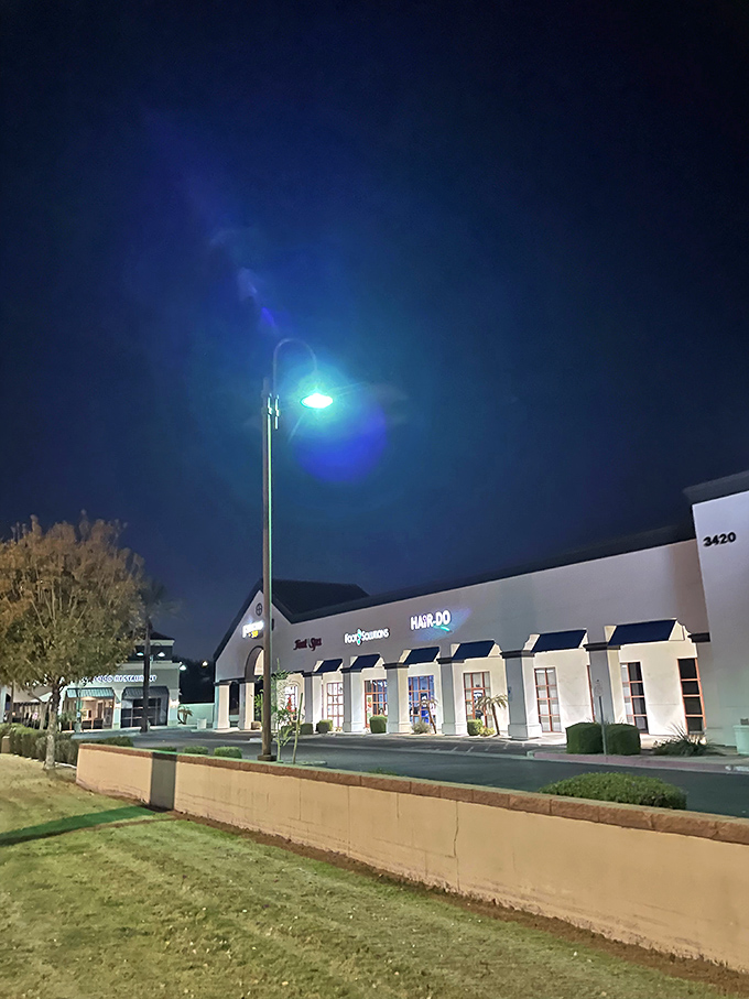 As night falls, this unassuming strip mall transforms into a beacon for seafood lovers. Arizona's best-kept secret glows.