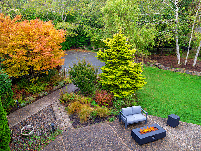 Bathed in golden sunset light, the castle's cedar-shingled turret and facade reveal why this hidden gem stops first-time visitors in their tracks.