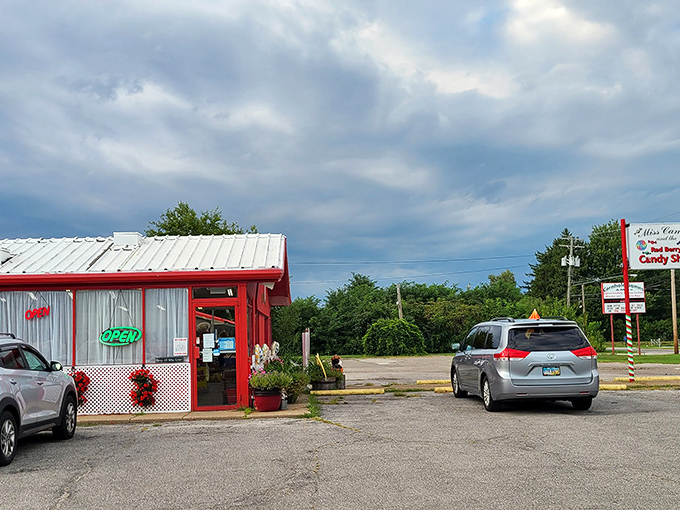 Even from the parking lot, the Red Berry Candy Shop promises a colorful escape from everyday life &ndash; a red-roofed portal to simpler times.