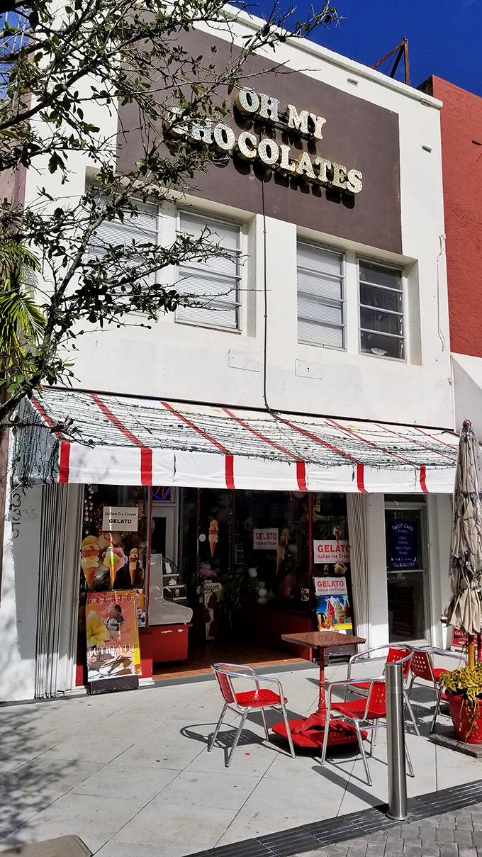 The unassuming exterior of Oh My Chocolates hides the wonderland within, like a chocolate truffle itself&mdash;simple outside, extraordinary inside. Red chairs invite you to linger.