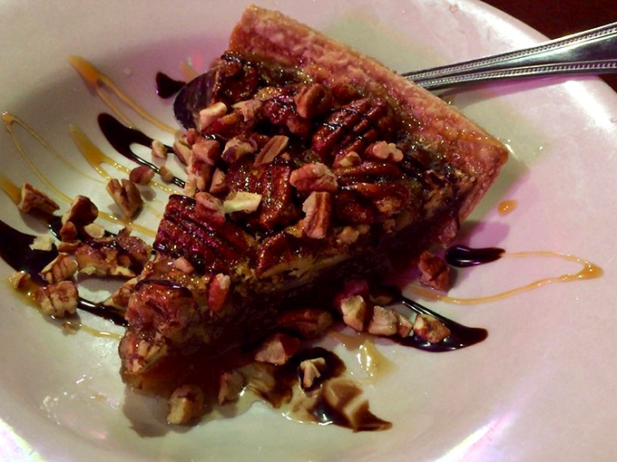 Pecan pie that would make a Southern novelist write another chapter. Drizzled with chocolate and topped with nuts, it's the sweet finale to a literary feast.