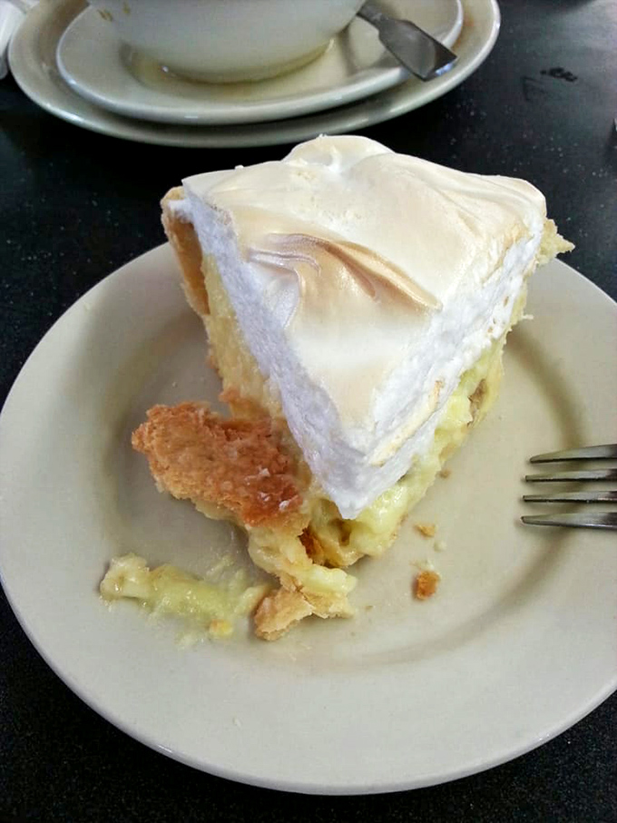 Lemon meringue pie with a cloud of perfectly browned meringue. That first fork breach is one of life's small but perfect pleasures.