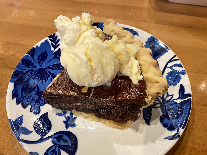 Chess pie with ice cream&mdash;proof that Kentucky knows dessert. That melting scoop creating a sweet river of vanilla across the warm filling is pure edible poetry.