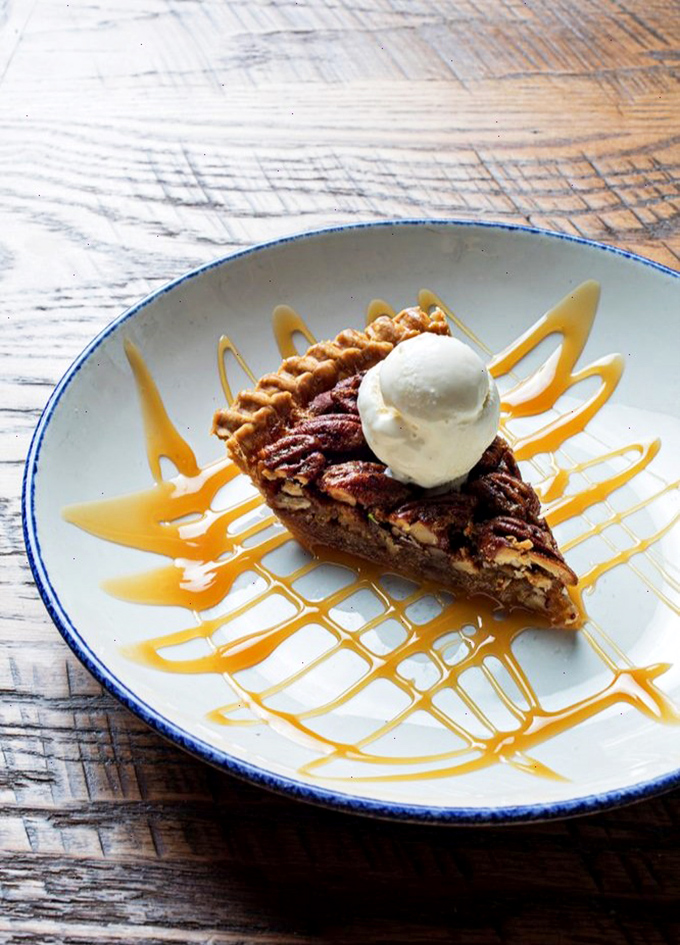 Pecan pie drizzled with caramel and topped with ice cream&mdash;the kind of dessert that makes you consider skipping straight to the final course.