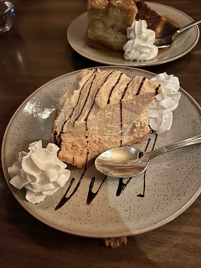 Pie shouldn't make you emotional, yet here we are. Whipped cream dollops stand like proud sentinels guarding treasure on a speckled plate.