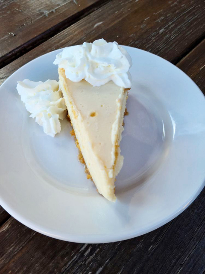 The sweet finale that whispers "save room." This key lime pie's velvety texture and cloud of whipped cream provides the perfect punctuation to a seafood feast.