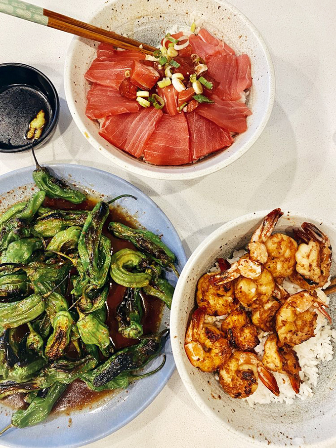 A feast fit for Neptune himself: fresh tuna, grilled shrimp, and blistered shishitos. The holy trinity of seafood satisfaction.