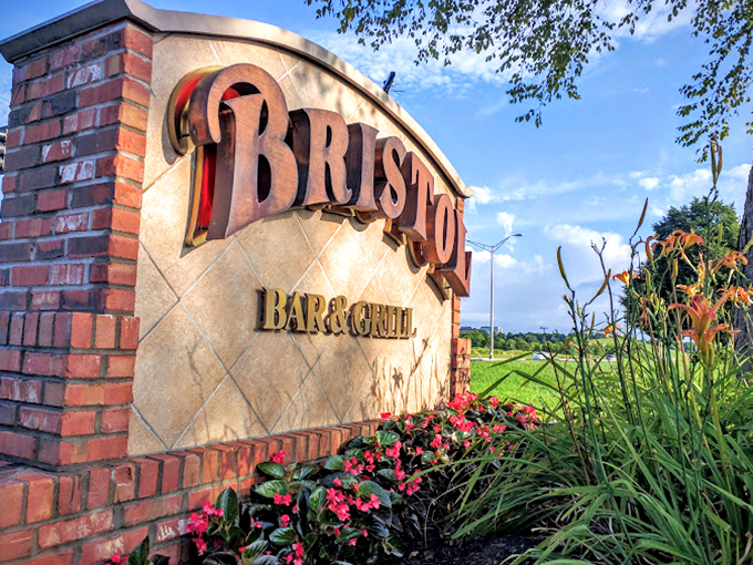 The entrance sign, framed by carefully tended flowers, offers the first hint that attention to detail matters deeply at this landlocked seafood haven.
