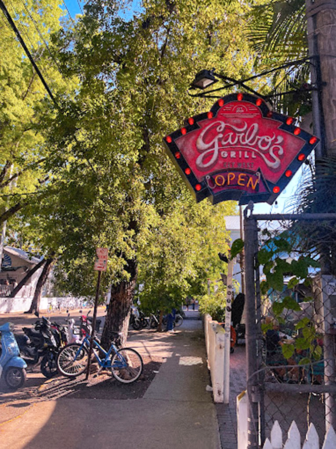 The glowing Garbo's sign serves as a culinary lighthouse, guiding hungry travelers to a port of exceptional flavors and island charm.