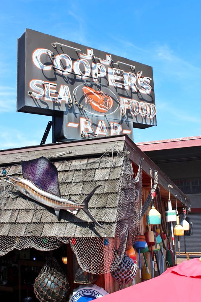 The arcade and memorabilia section marries nostalgia with nautical flair. Nothing says "seafood restaurant" quite like Zoltar and vintage arcade games.