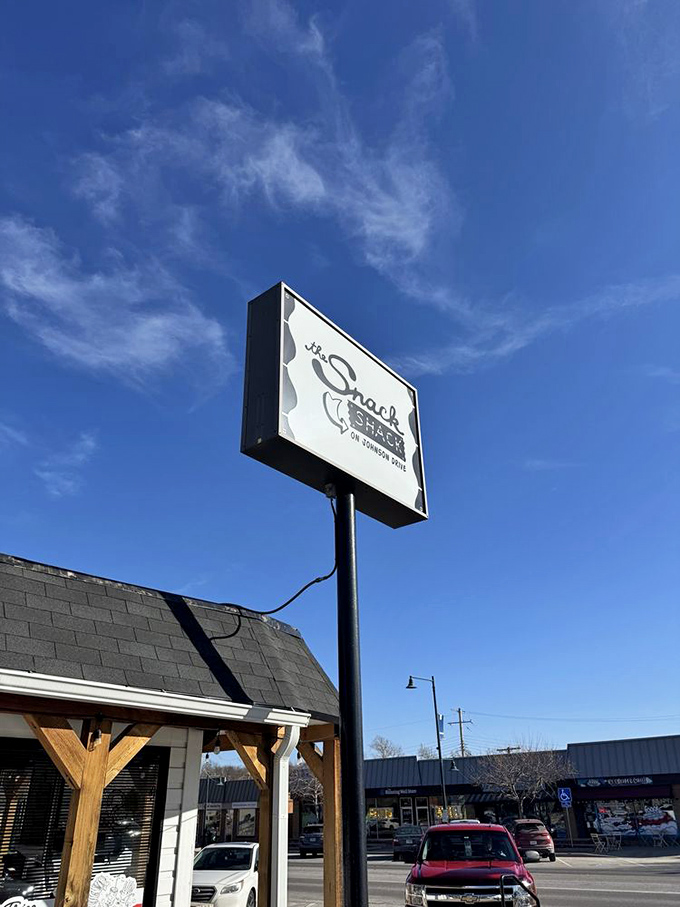 Against that Kansas blue sky, the Snack Shack sign isn't just advertising&mdash;it's a beacon calling hungry travelers home.