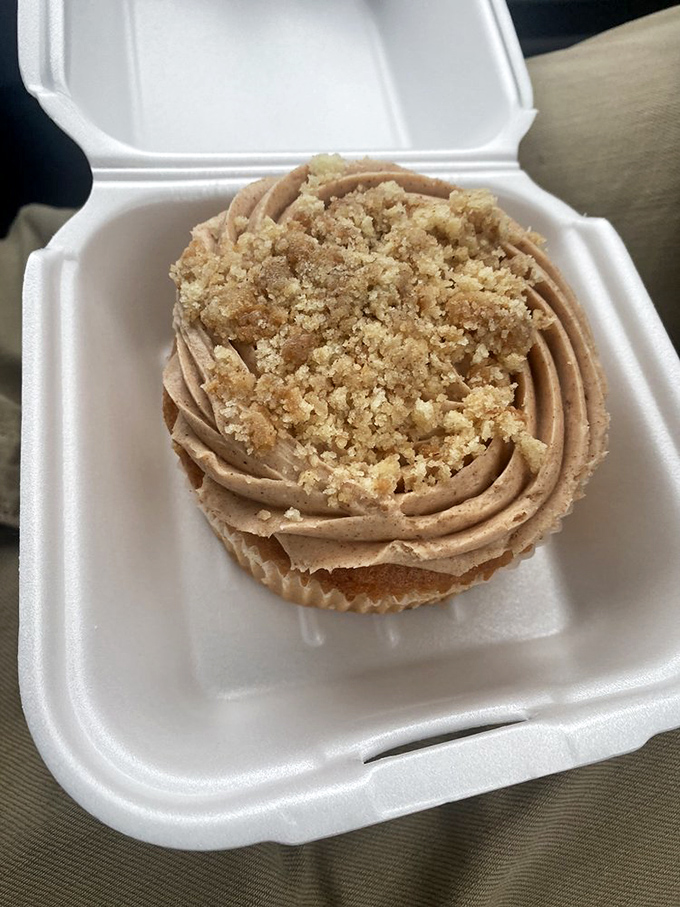 A cupcake so perfectly swirled it belongs in an art gallery, but tastes too good to just stare at.