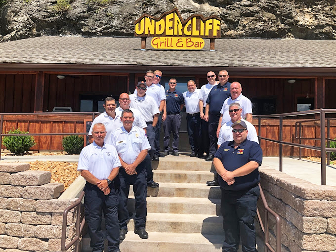 The team that keeps the cliff kitchen running. These folks serve up hospitality as solid as the rock wall behind them.