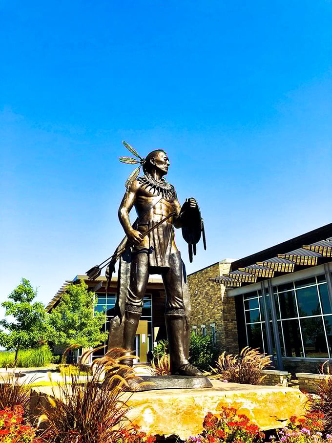 A proud sentinel stands guard outside the chocolate kingdom, honoring heritage while welcoming sweet-toothed visitors from all directions.