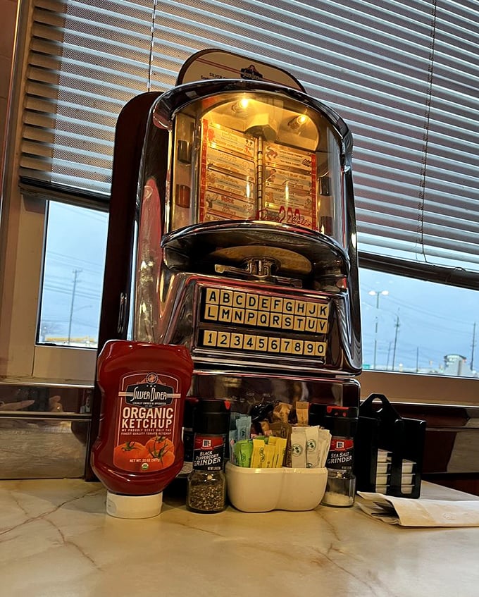 The tabletop jukebox and condiment station—where every great diner meal begins with the age-old question: "How much ketchup is too much ketchup?"