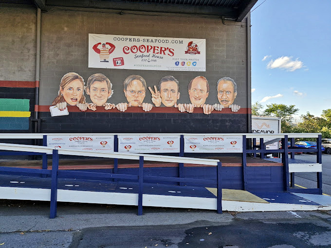 Where nautical meets theatrical—every inch of wall space tells a story, creating the perfect backdrop for your own seafood adventure.