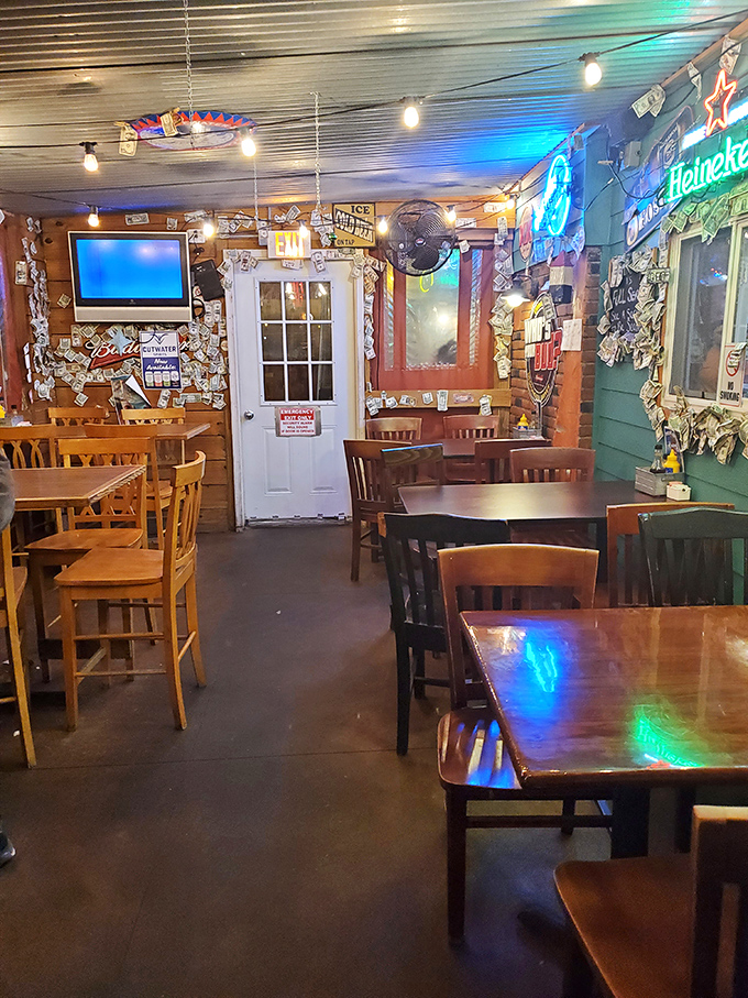 The dining room's glow comes from both the neon signs and the satisfied smiles of diners. This is where memories are made, one perch basket at a time.