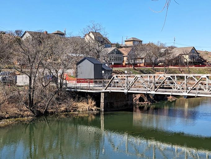 Winter reveals Medicine Park's bones &ndash; the bare trees and bridge creating a serene landscape that shows this town is beautiful in every season.