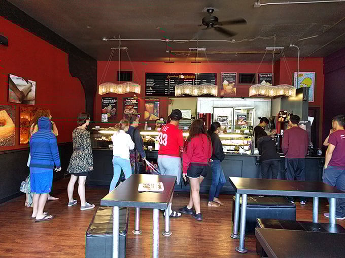 The line forms early at Legendary Doughnuts, where strangers become comrades united in the noble pursuit of fried perfection.