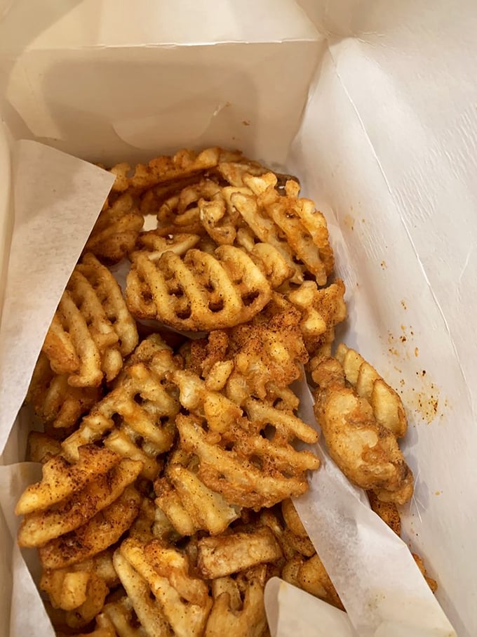 Waffle fries dusted with spice&mdash;the perfect vehicle for sauce transportation. Not just a side dish, but an essential supporting character in your meal's story.