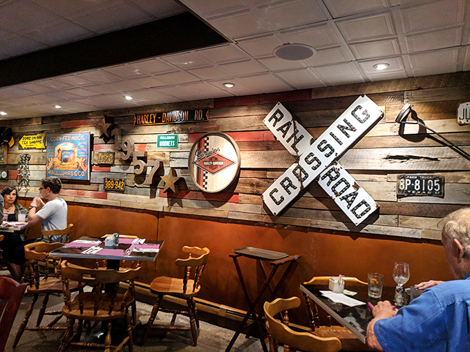 The railroad crossing sign warns of no dangers, only delicious detours ahead as diners settle into comfortable conversations and anticipation.