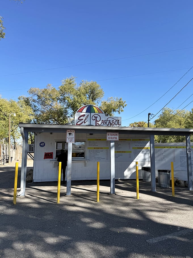 The humble roadside stand with its cheerful umbrella logo promises more flavor per square foot than establishments ten times its size.