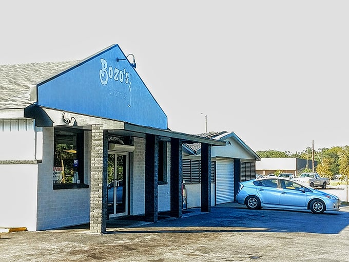 The blue beacon of Bozo's! This seafood market's no-nonsense exterior promises treasures from the Gulf inside.