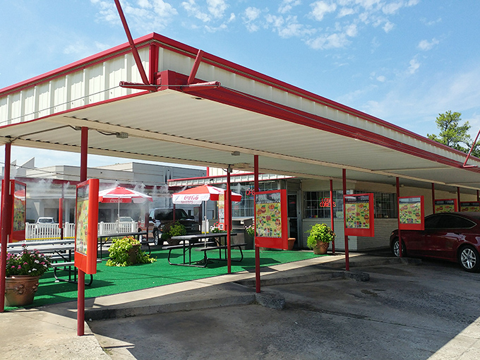 That iconic red-trimmed canopy isn't just shelter &ndash; it's a time portal to when dinner came with roller skates and optimism.