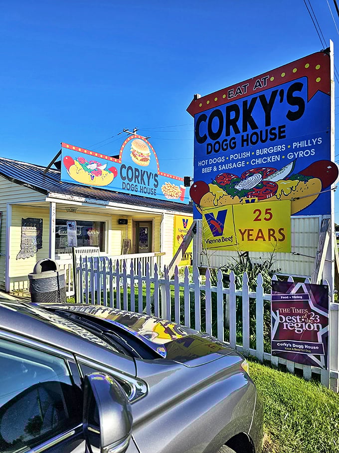 Corky's colorful storefront promises hot dog heaven behind that white picket fence &ndash; Americana served with a side of neon nostalgia.