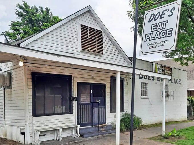 The unassuming exterior of Doe's Eat Place hides a steak paradise that would make carnivores weep with joy.