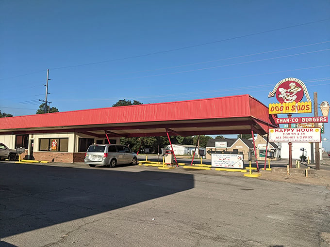 The iconic red roof of Dog N Suds beckons like a mirage for hungry travelers &ndash; a time capsule of Americana serving happiness on a bun.