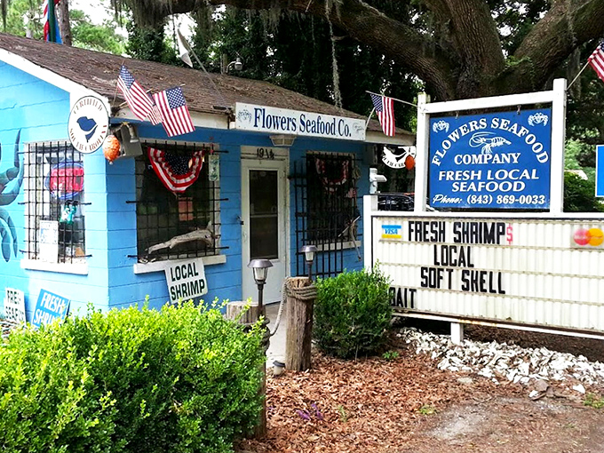 The little blue shack that could! Flowers Seafood Co's patriotic facade promises treasures from the sea without the fancy fuss.