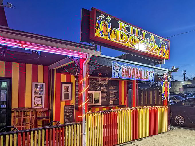 Killa Dogz's vibrant red and yellow facade isn't just eye-catching&mdash;it's a neon-lit beacon for hot dog aficionados seeking frankfurter nirvana.