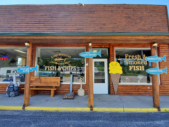 King's Fish Market: The log cabin exterior with colorful fish signs promises seafood treasures that would make Captain Ahab change his target.