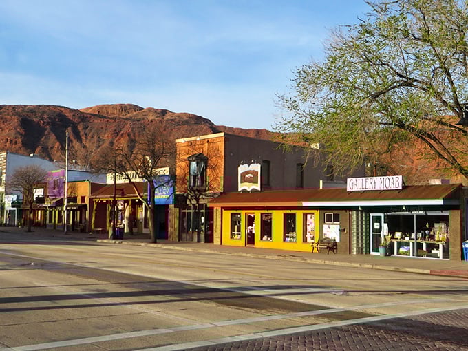 Moab's main street &ndash; where desert-chic meets outdoor adventure, and every storefront seems to whisper, "Come in, the air conditioning is fantastic."