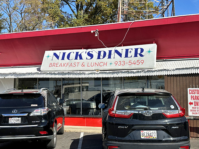 Nick's Diner exterior beckons with its cherry-red awning &ndash; like finding the ruby slippers on your quest for perfect pancakes.