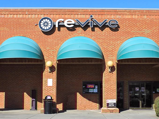 Revive Consignment's teal awnings aren't just decorative—they're beacons guiding fashion-forward bargain hunters to their promised land.