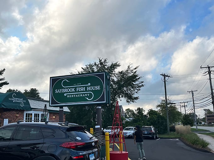 The Saybrook Fish House sign stands like a beacon of hope for seafood lovers—promising salvation from mediocre meals and sad salads.