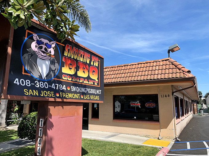 Smoking Pig BBQ: The cartoon pig on the sign isn't smiling because he knows what's happening inside &ndash; barbecue magic that'll make you weak in the knees.