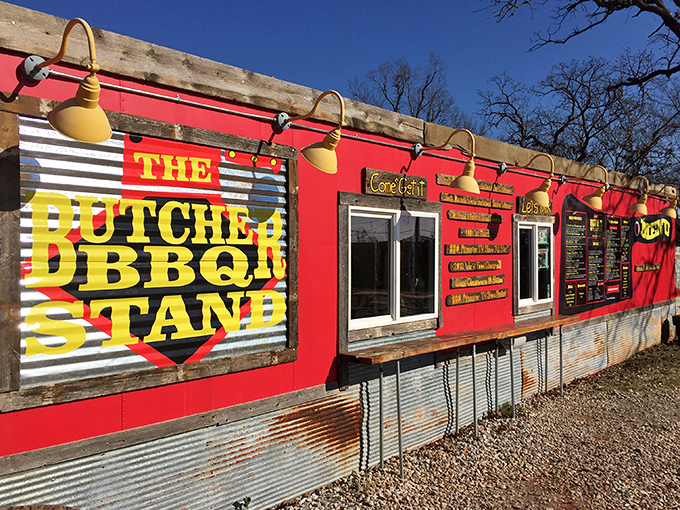 The Butcher BBQ Stand's vibrant red exterior isn't just eye-catching&mdash;it's a smoke signal to your stomach that greatness awaits inside.