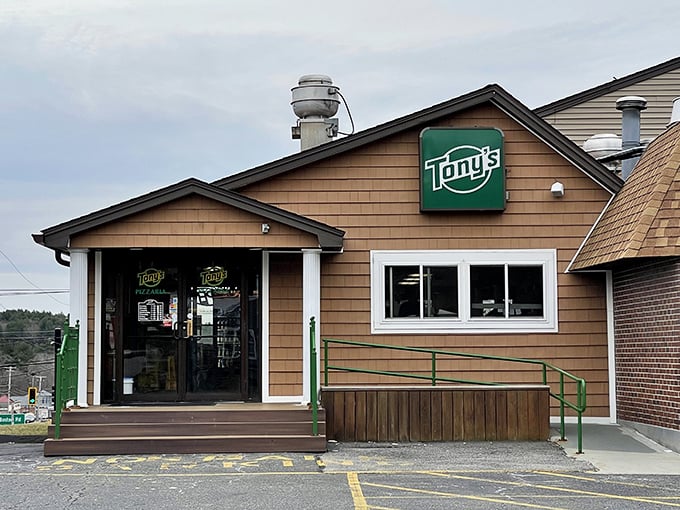 Tony's Pizza Restaurant Sutton: "No flashy neon necessary—the real fireworks happen in the oven where generations of pizza mastery unfold nightly."