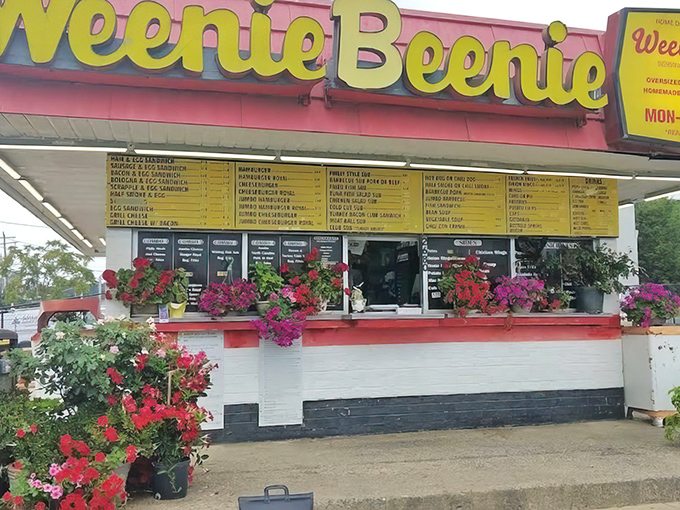 The iconic Weenie Beenie sign promises hot dog heaven! Those vibrant yellow letters have been guiding hungry travelers for generations.