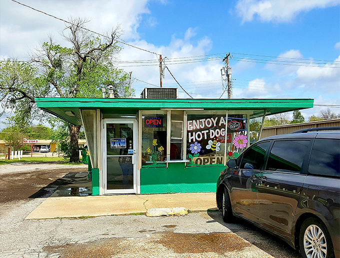 Cherry limeade and sunshine! This mint-green hot dog haven looks like it was plucked straight from a Wes Anderson film set.