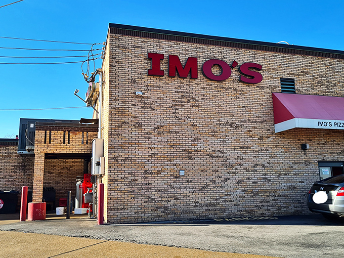 Red letters, big flavor. Imo's stands like a pizza sentinel, guarding the sacred recipe for St. Louis-style squares that locals defend with religious fervor.