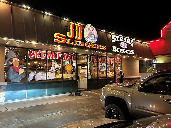 By night, JD Slingers transforms from family diner to steak sanctuary. That neon glow is basically a bat signal for carnivores.