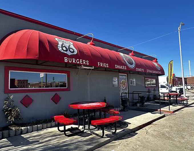 Where burger meets griddle magic. That red awning isn't just decoration&mdash;it's a beacon calling to onion burger pilgrims.